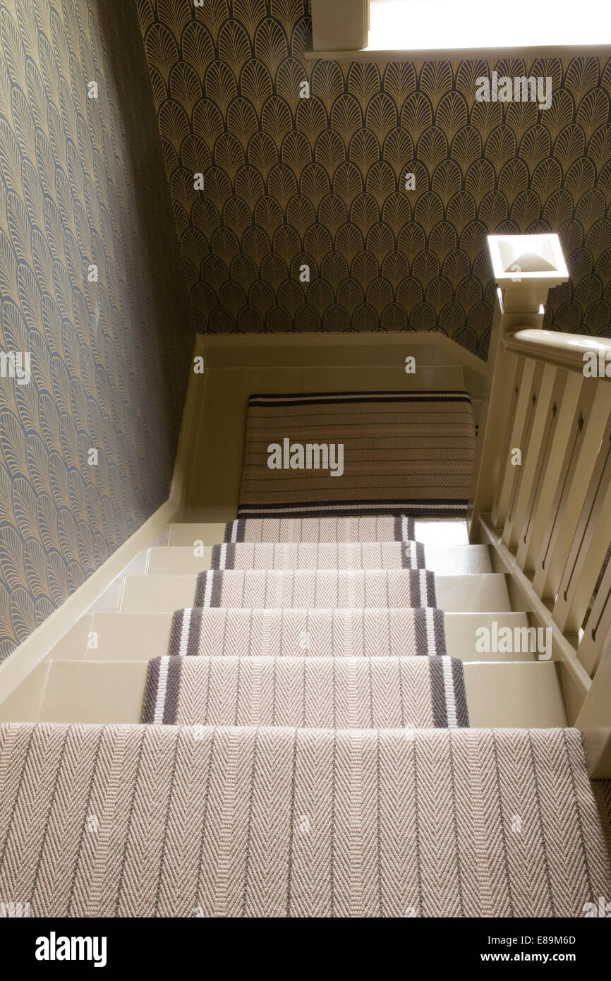 View from above of staircase with grey carpet and wallpaper Stock Photo ...