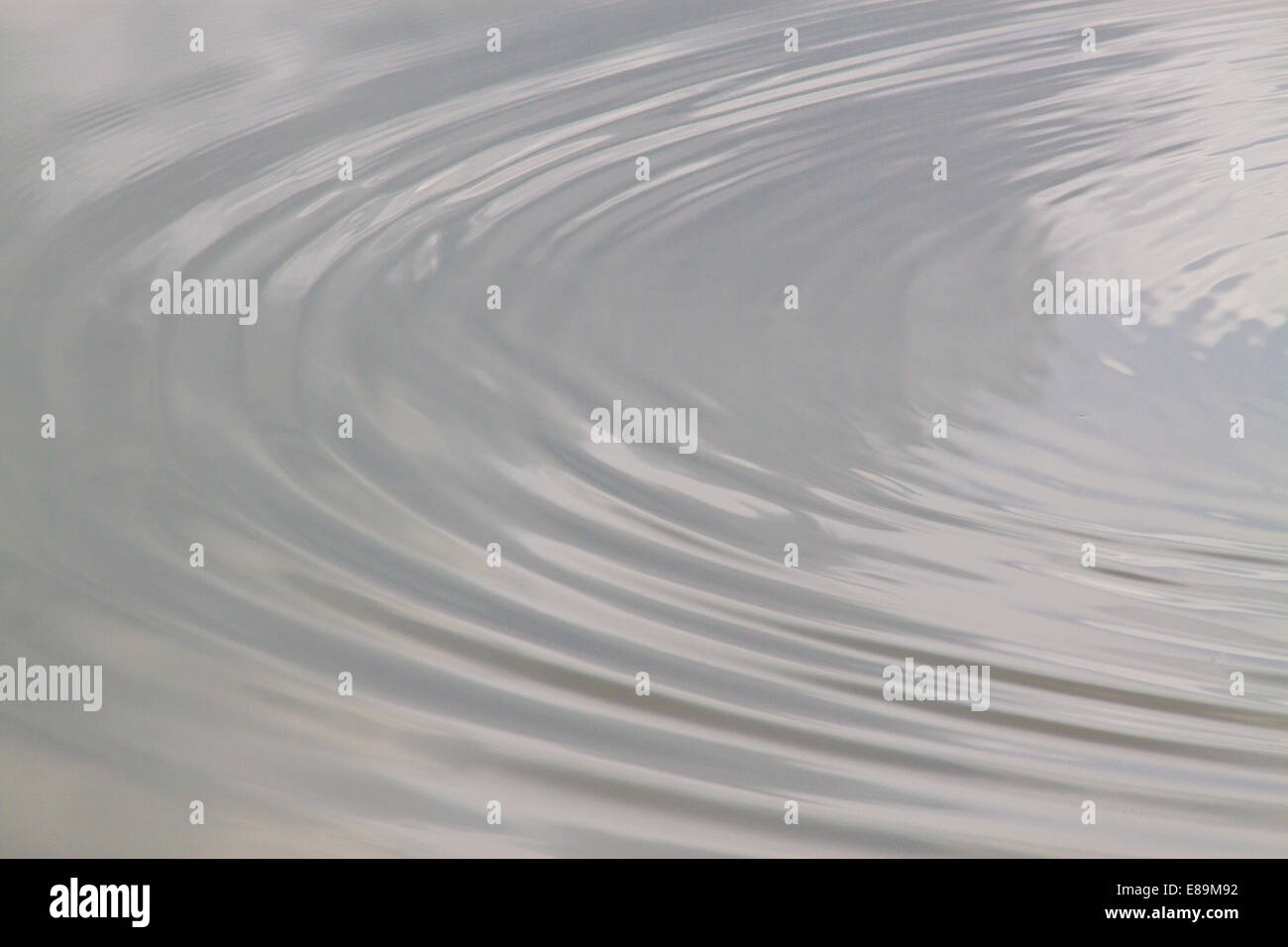 Ripples in Water Radiating from Center Stock Photo - Alamy