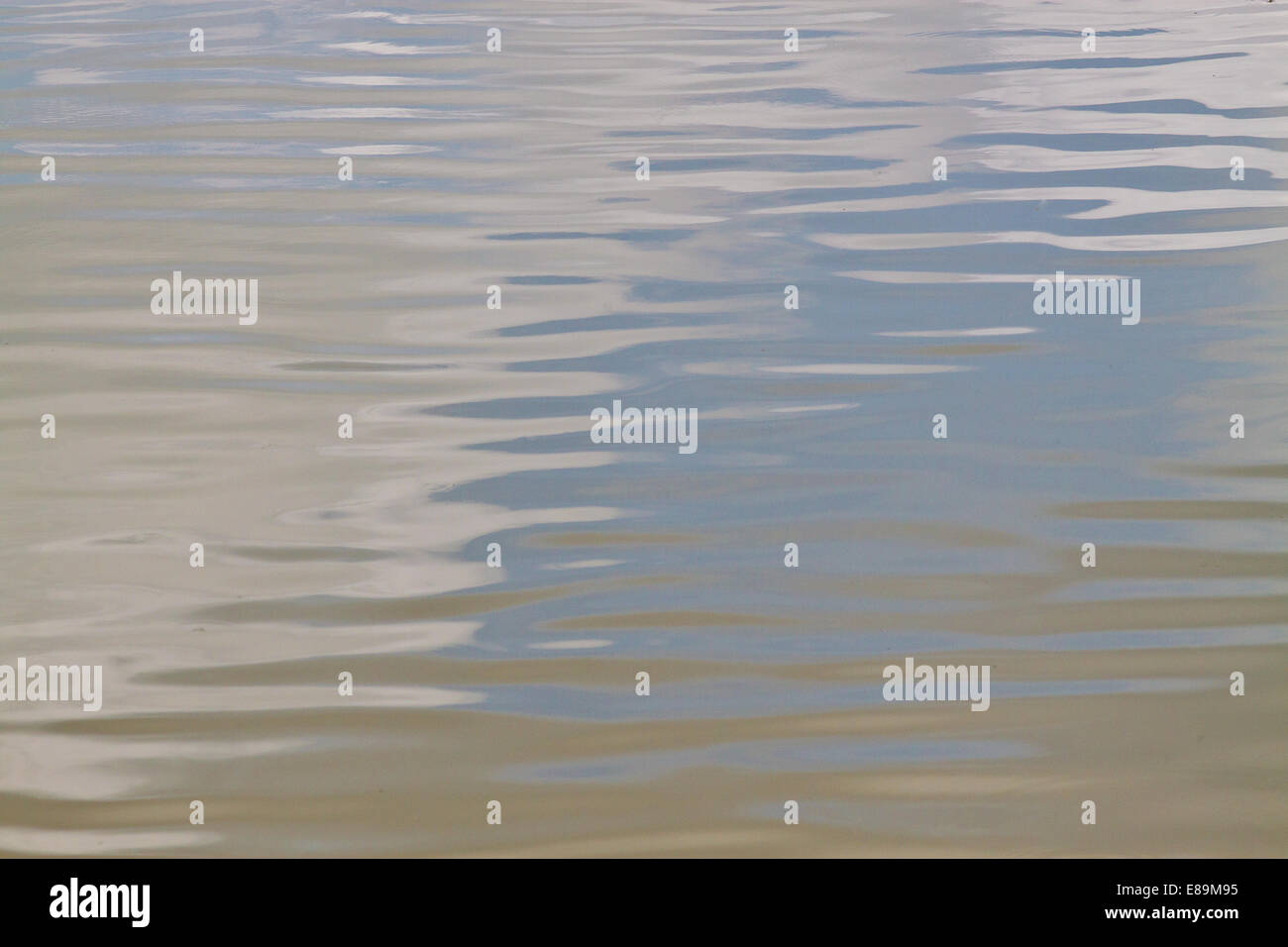 Ripples on Lake Reflecting Sunlight Stock Photo - Alamy