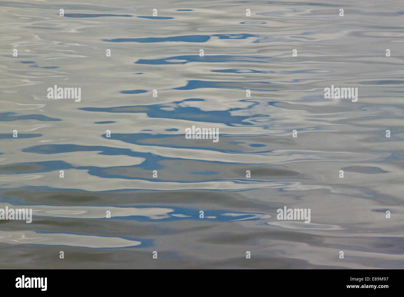 Light Reflecting on Lake Ripples Stock Photo - Alamy