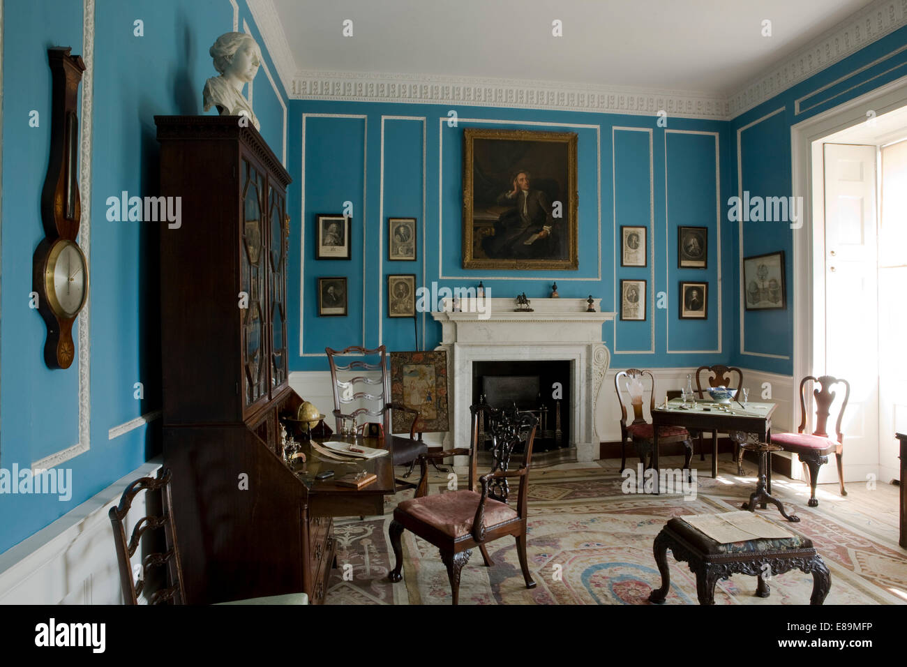 Antique bureau and chairs in blue country house study Stock Photo - Alamy