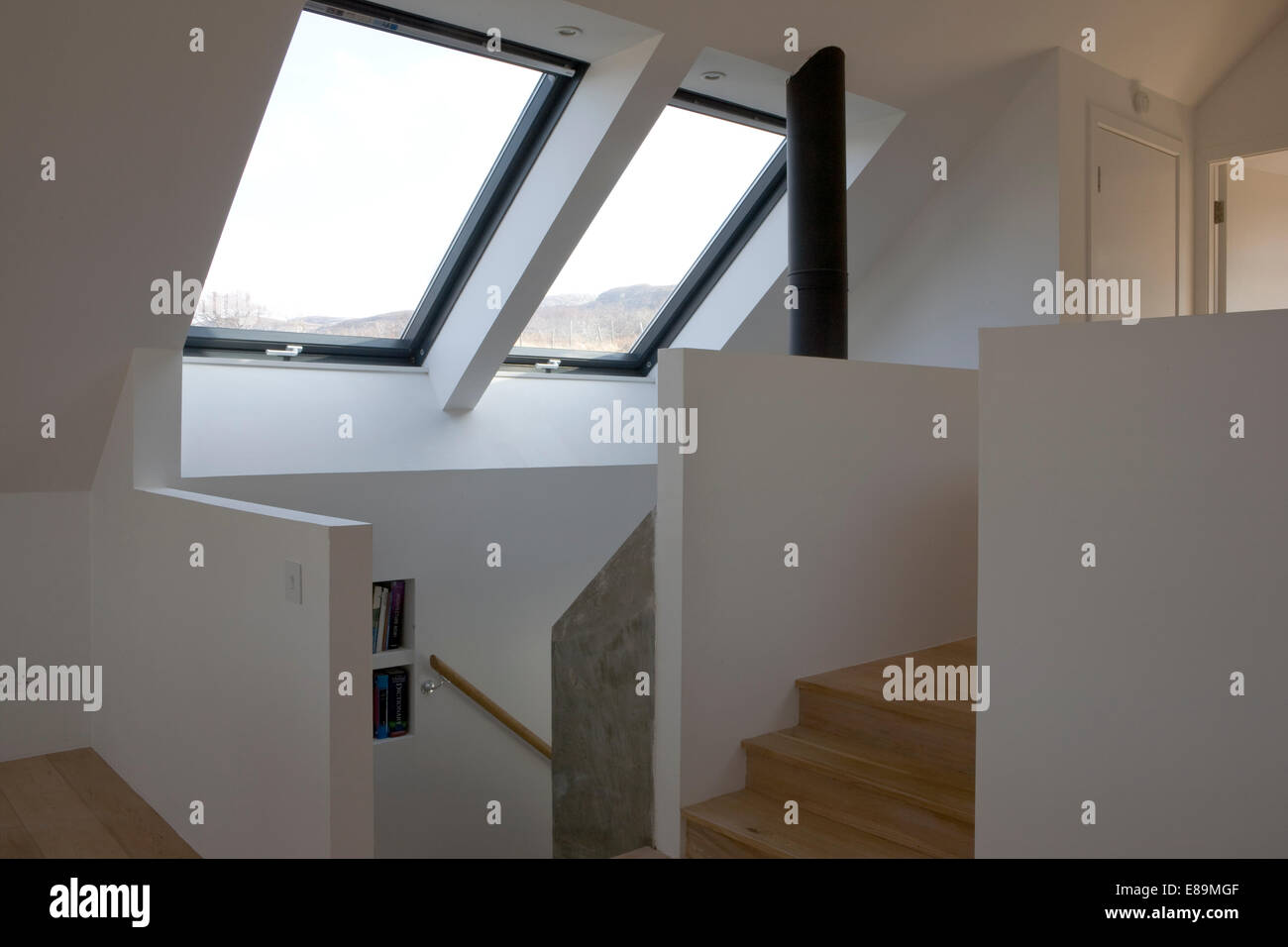 Velux windows above modern stairs and landing Stock Photo - Alamy