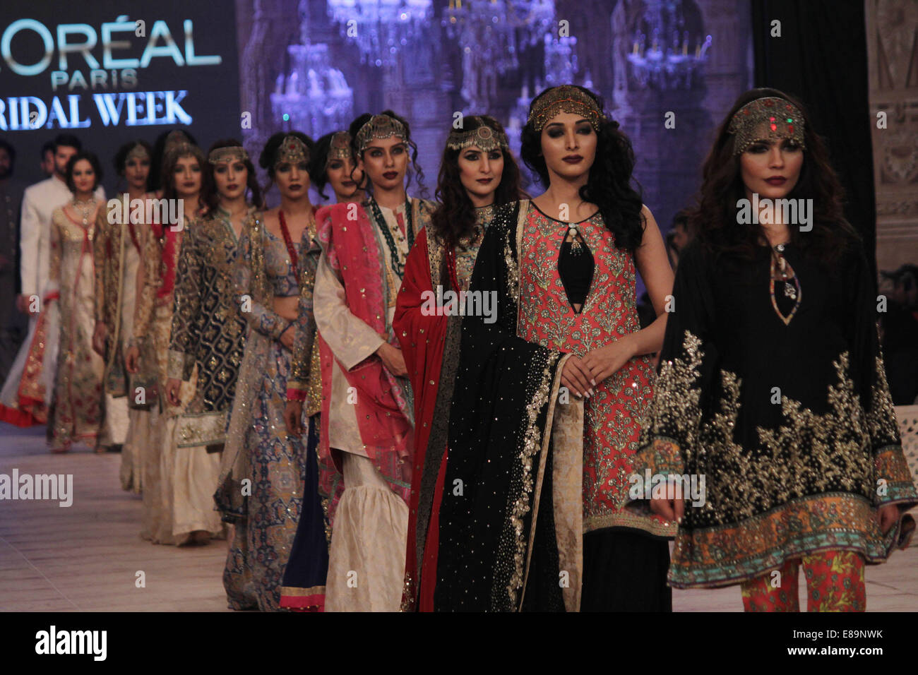 Lahore, Pakistan. 1st October, 2014. Models walk on a ramp to present ...