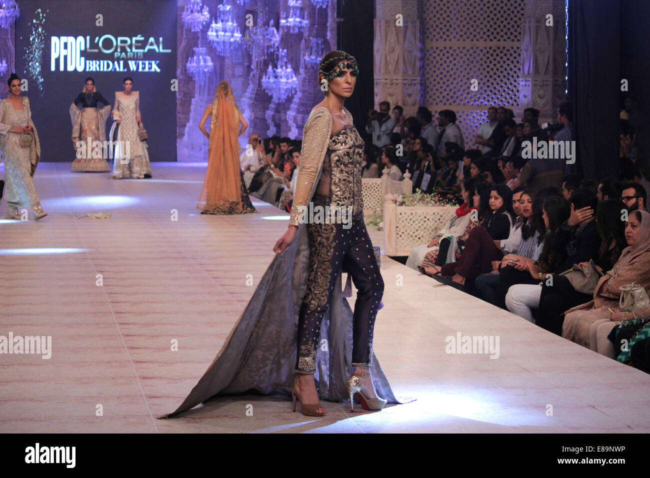Lahore, Pakistan. 1st October, 2014. Models walk on a ramp to present ...