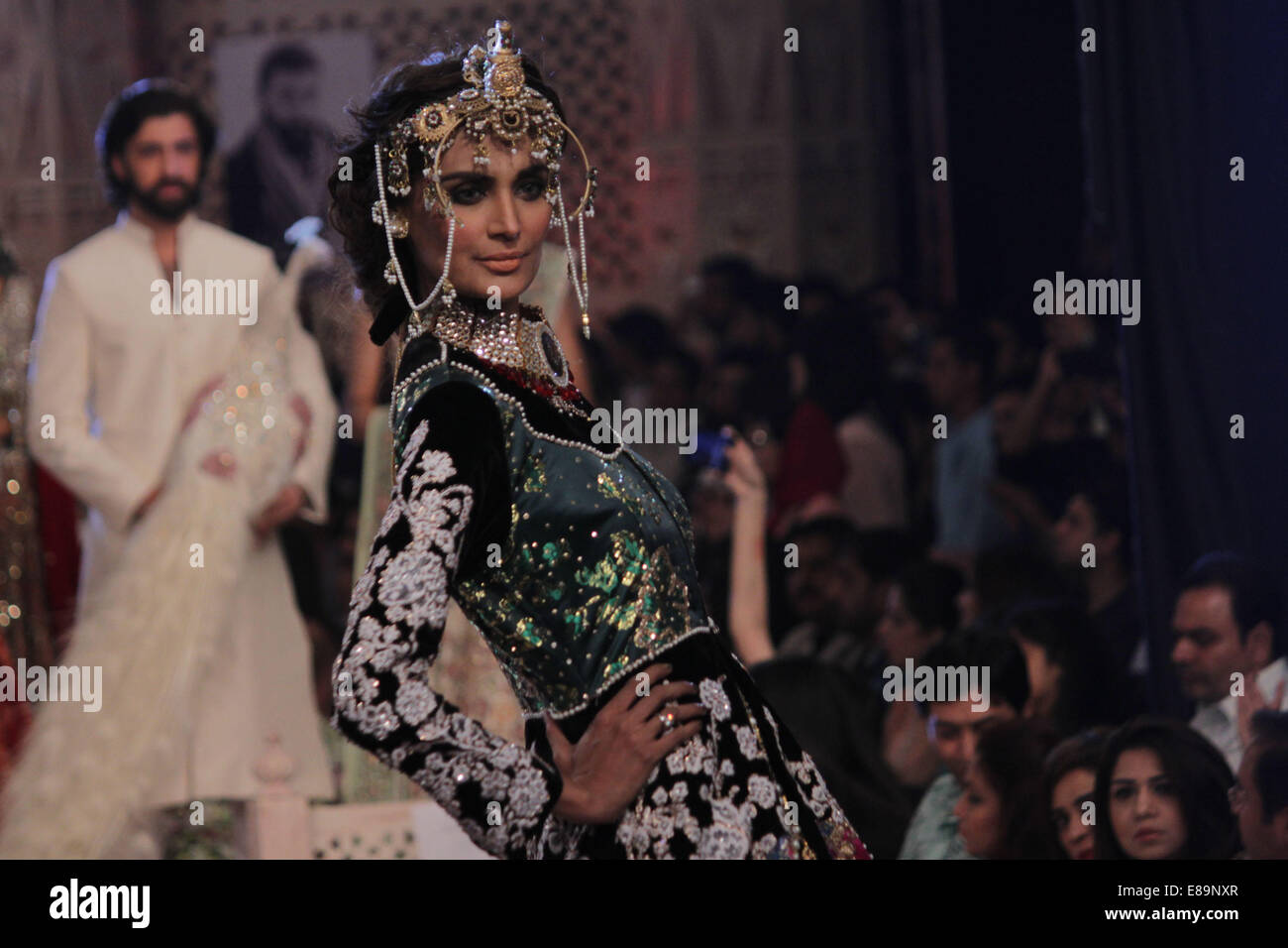 Lahore, Pakistan. 1st October, 2014. Models walk on a ramp to present ...