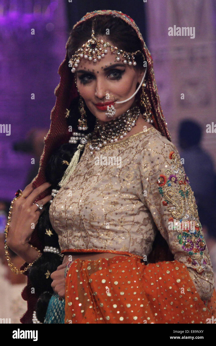 Lahore, Pakistan. 1st October, 2014. Models walk on a ramp to present ...