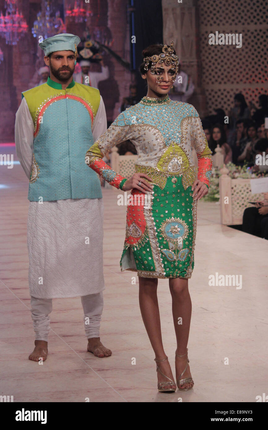 Lahore, Pakistan. 1st October, 2014. Models walk on a ramp to present ...