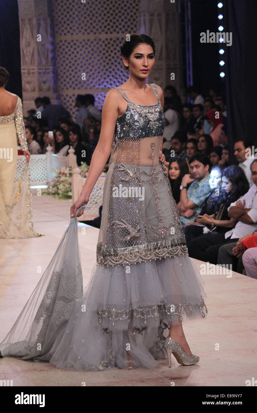 Lahore, Pakistan. 1st October, 2014. Models walk on a ramp to present ...