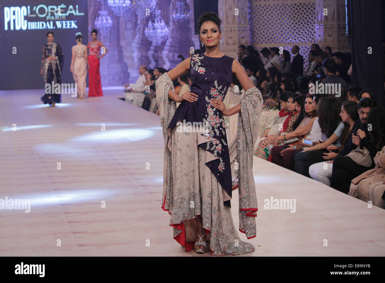 Lahore, Pakistan. 1st October, 2014. Models walk on a ramp to present ...