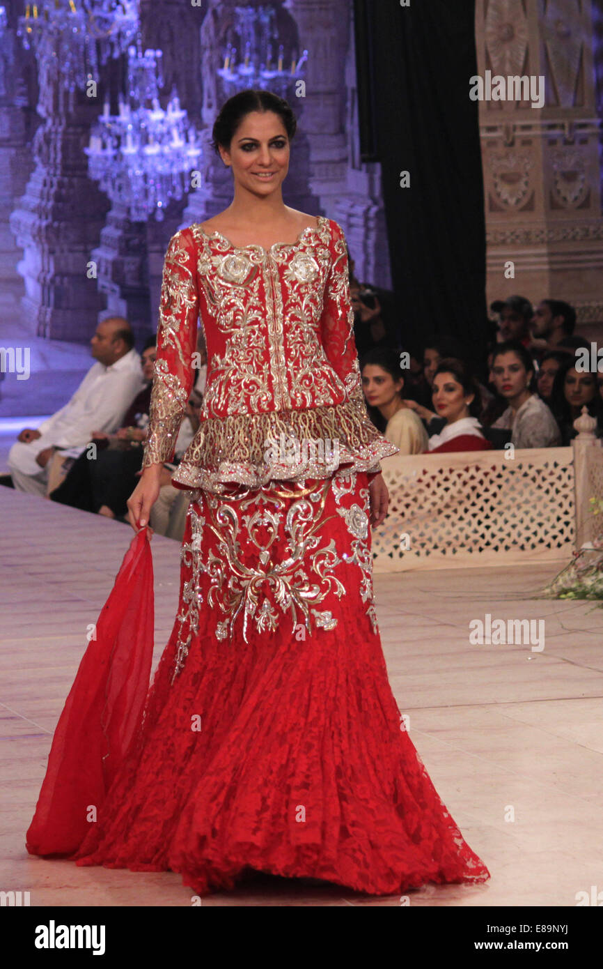 Lahore, Pakistan. 1st October, 2014. Models walk on a ramp to present ...