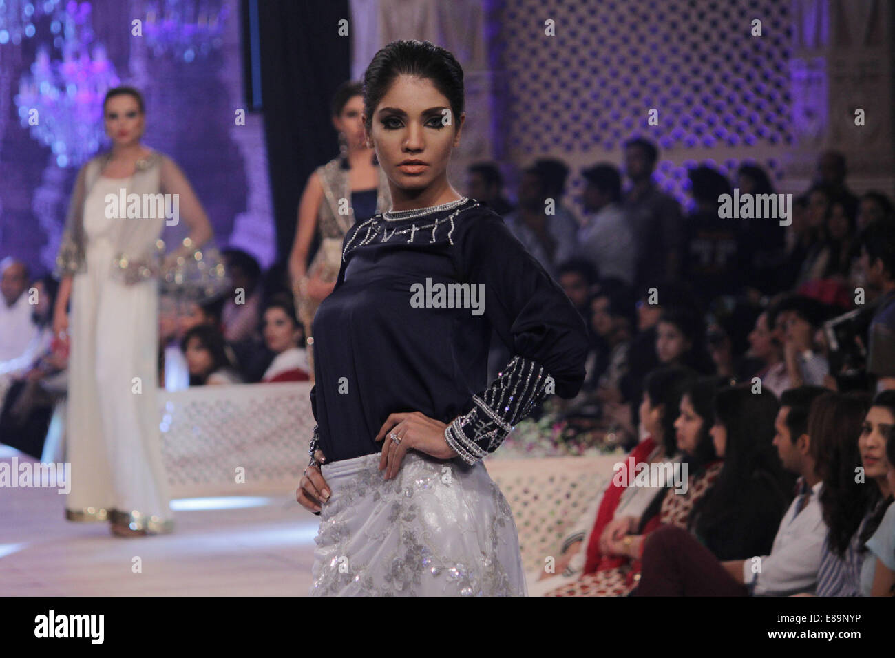 Lahore, Pakistan. 1st October, 2014. Models walk on a ramp to present ...
