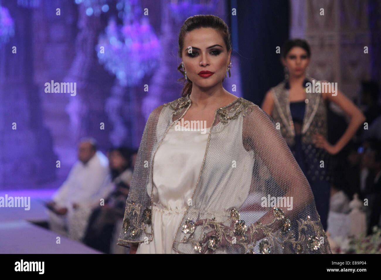 Lahore, Pakistan. 1st October, 2014. Models walk on a ramp to present ...