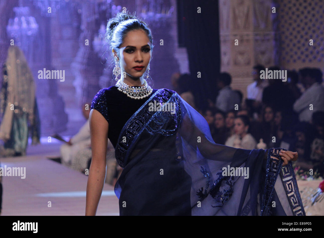 Lahore, Pakistan. 1st October, 2014. Models walk on a ramp to present ...