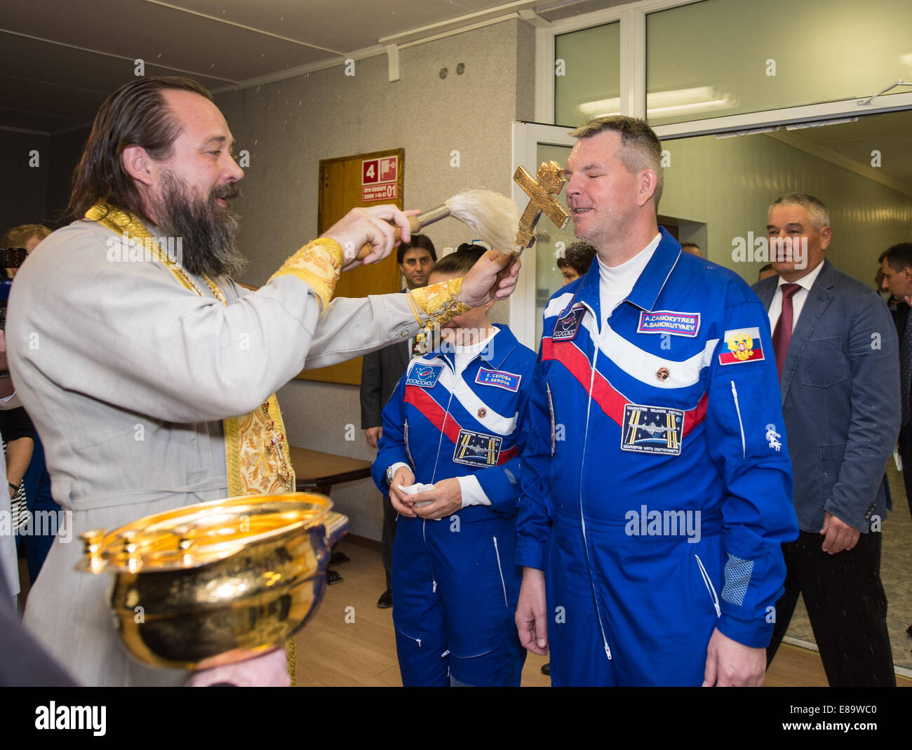 Soyuz Commander Alexander Samokutyaev receives a traditional blessing ...