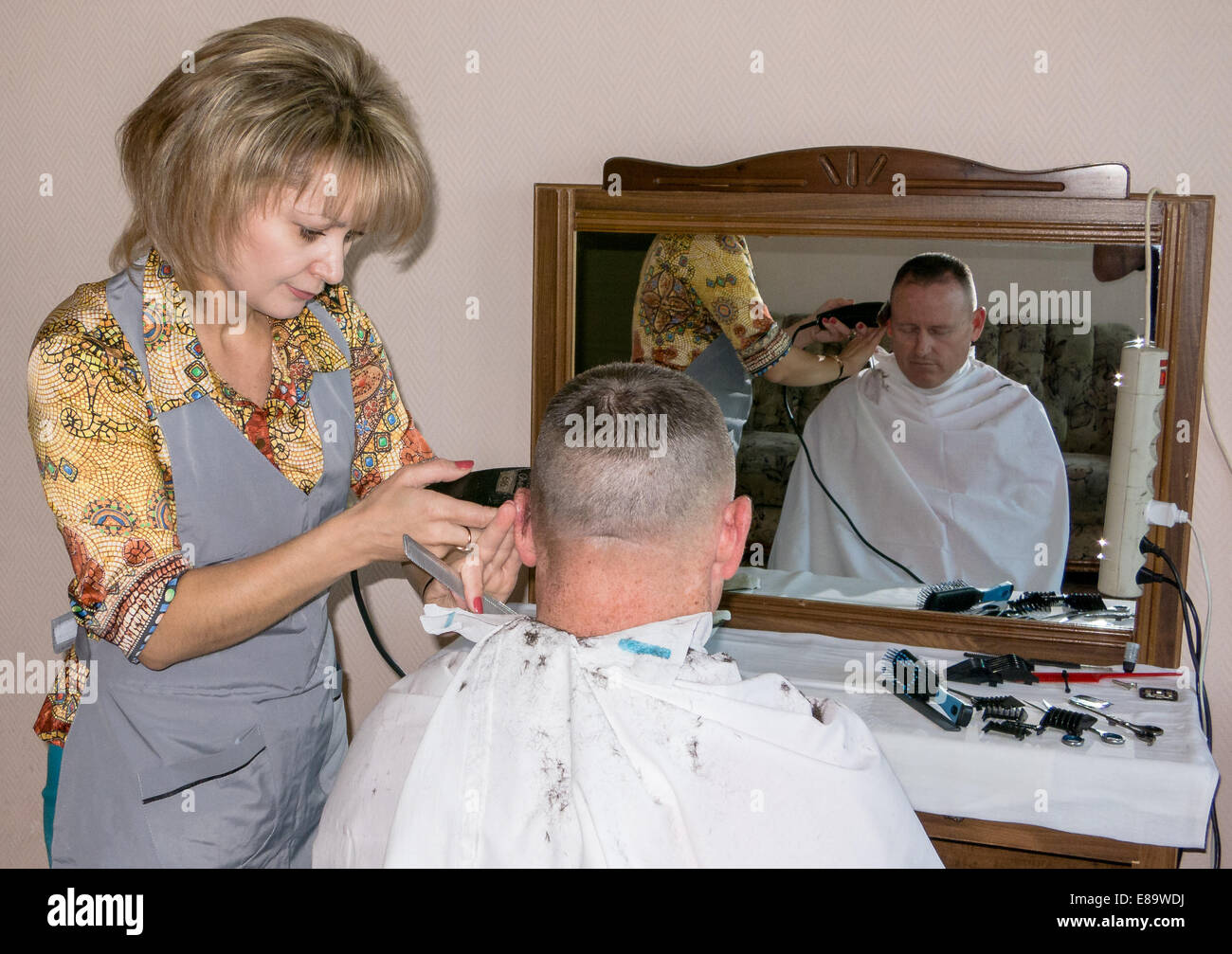 NASA astronaut Barry Wilmore receives a prelaunch haircut at the ...