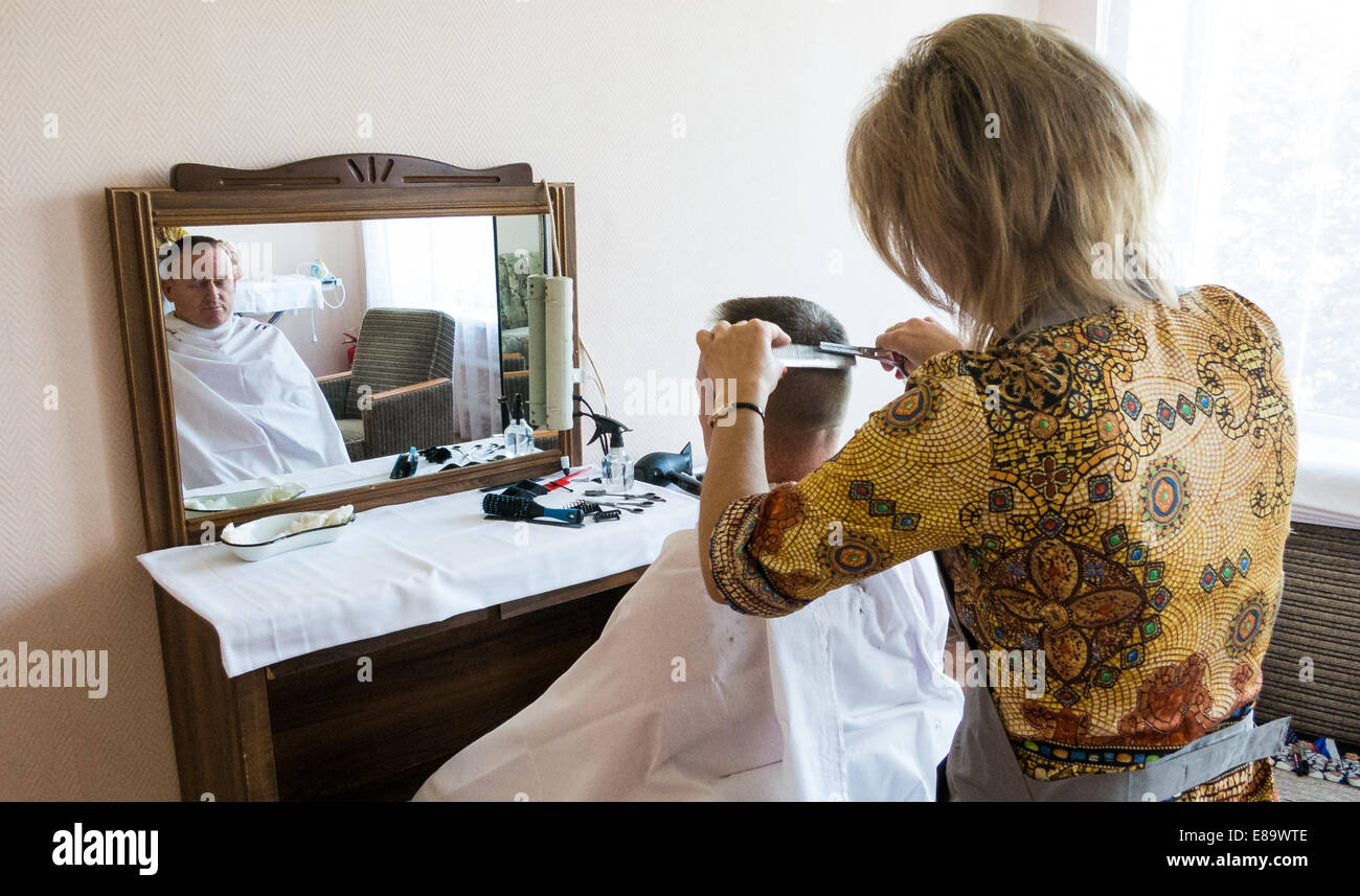 Barry Wilmore, NASA astronaut, gets a haircut at the Cosmonaut Hotel in ...