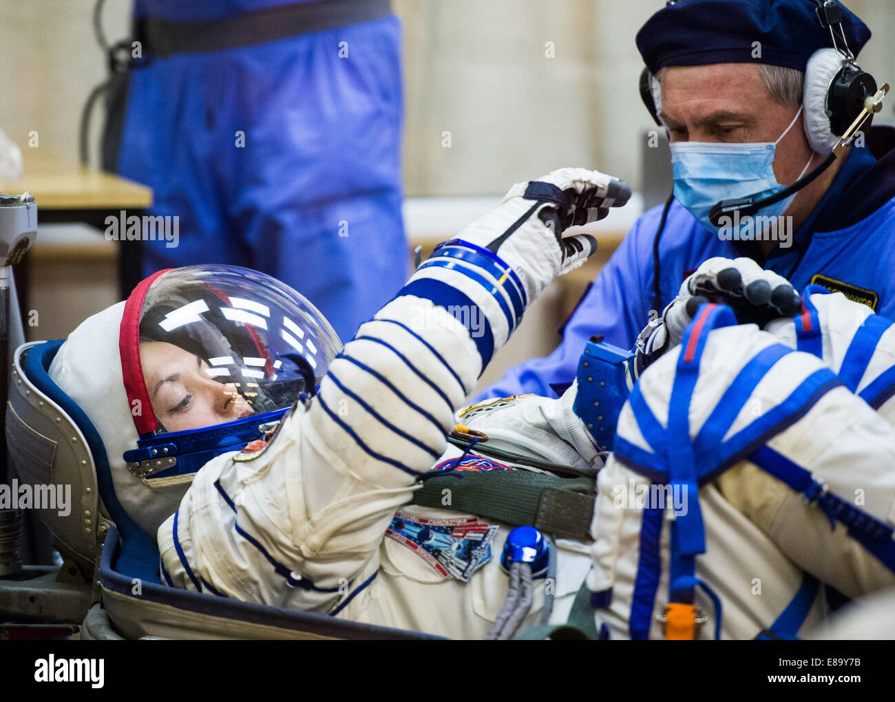Expedition 41 flight engineer Elena Serova of Roscosmos prepares for ...