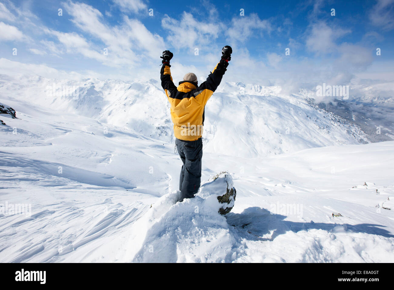 Mountain climber being pleased about reaching the mountain summit ...