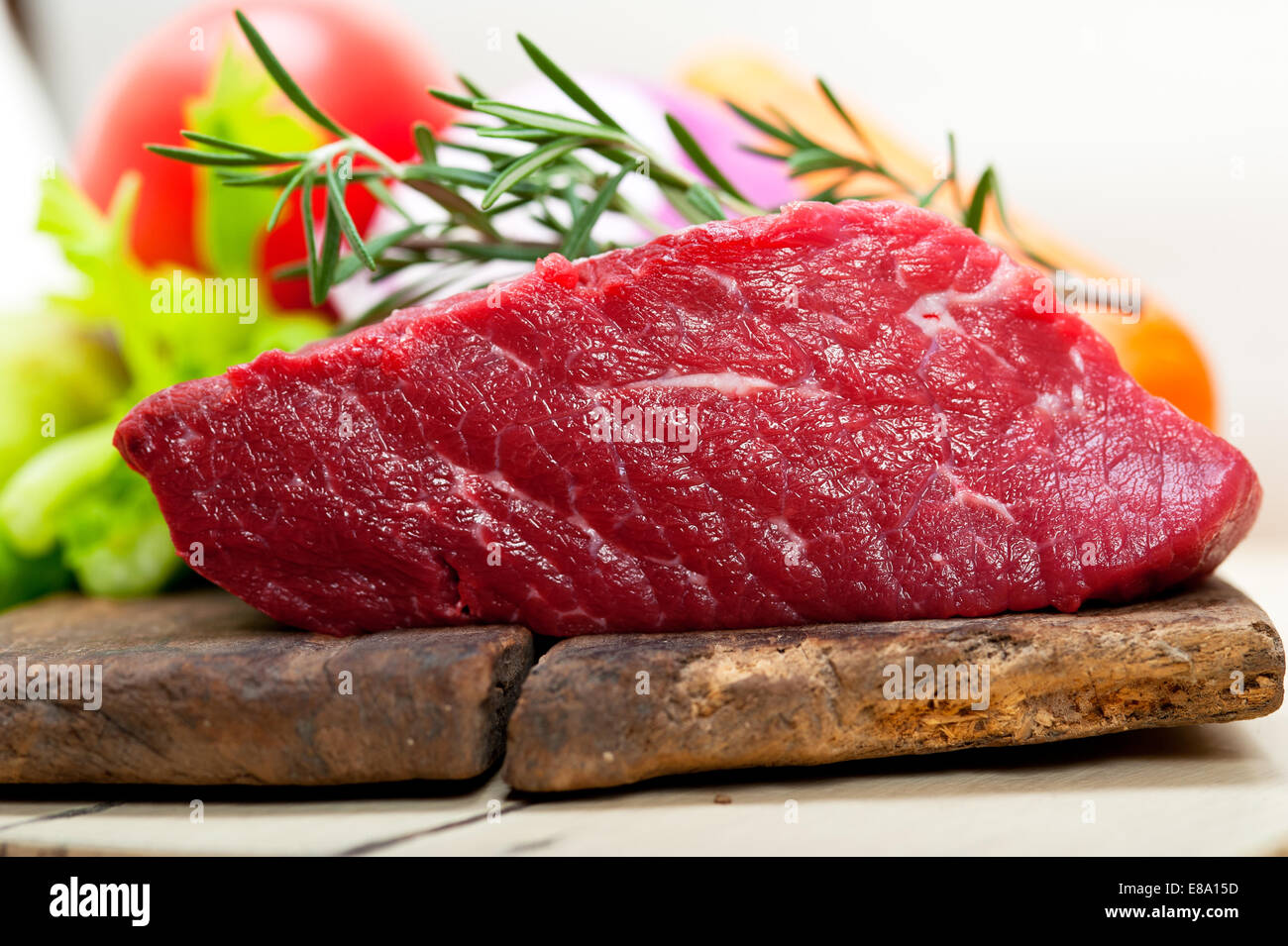 fresh raw beef cut ready to cook with vegetables and herbs Stock Photo ...