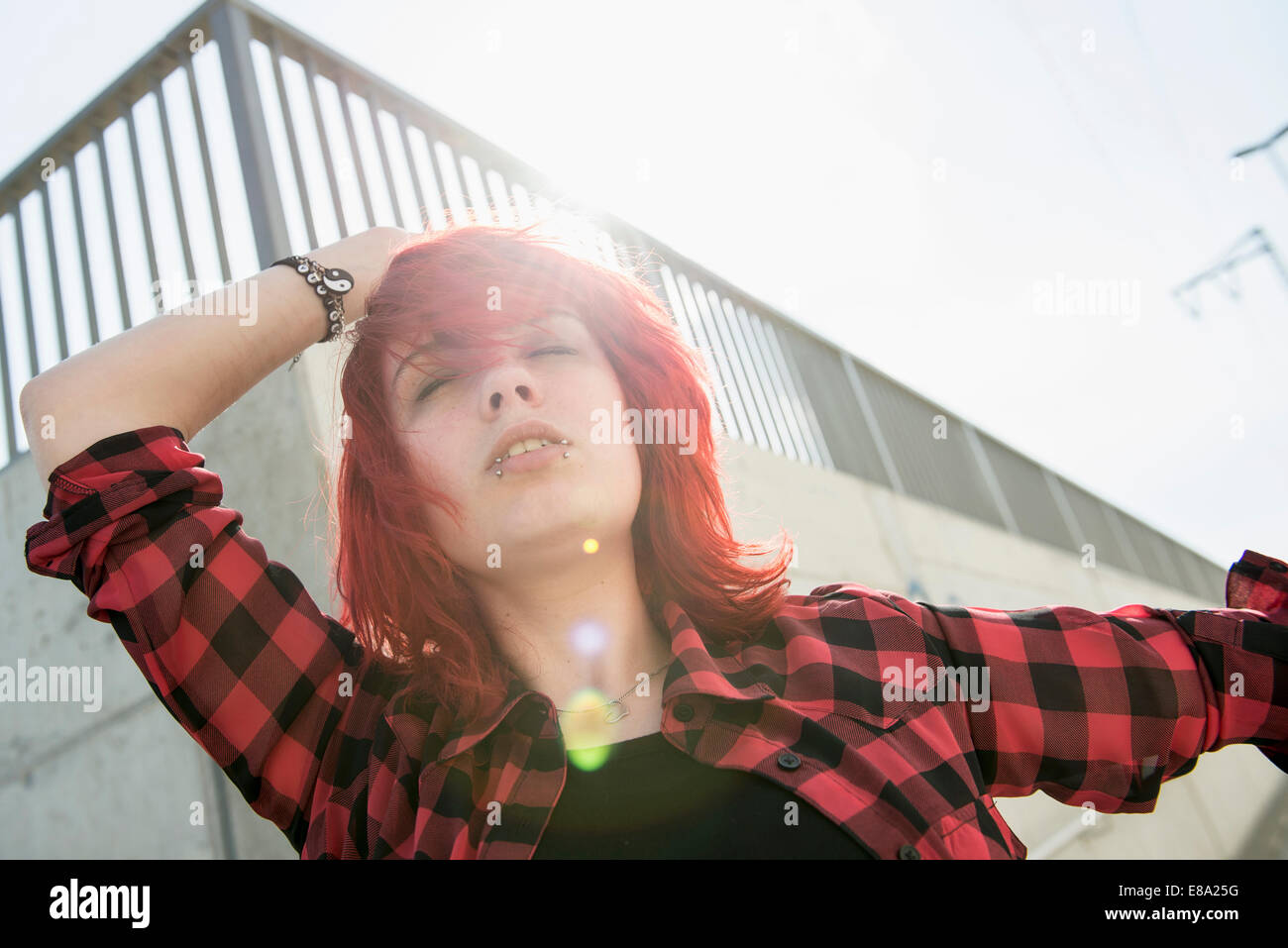 Young teenage girl dancing bright red dyed hair Stock Photo - Alamy