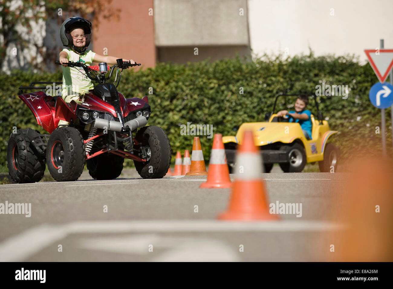 Two children on driver training area Stock Photo - Alamy