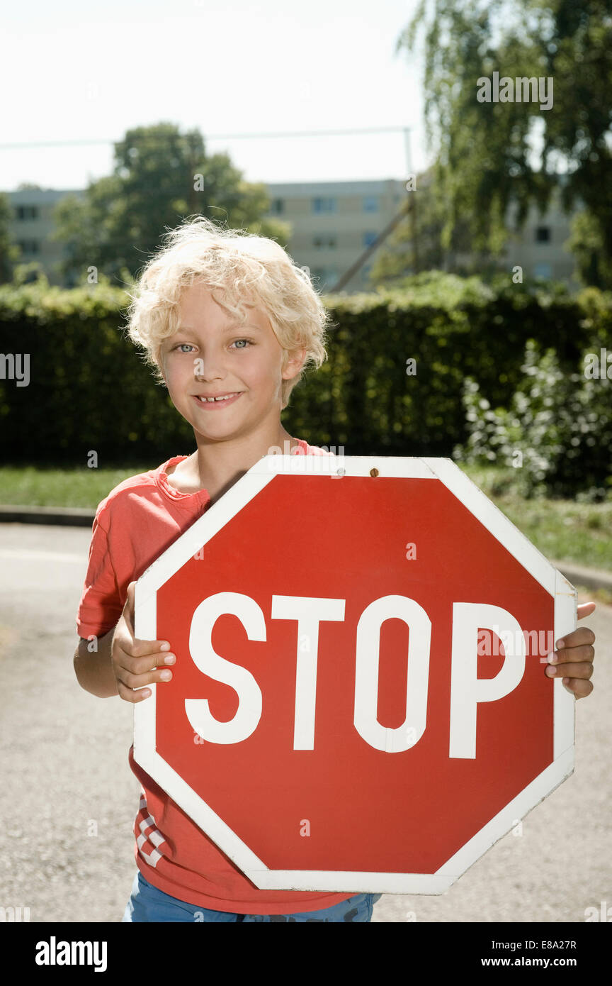 Holding stop sign hi-res stock photography and images - Alamy