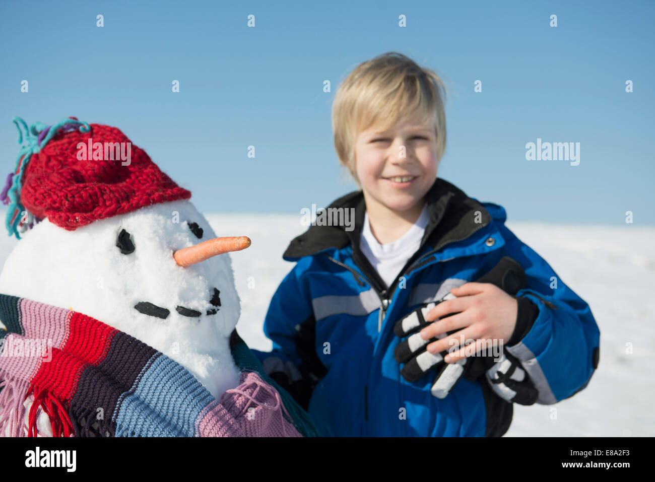 Boy standing with snowman, Bavaria, Germany Stock Photo - Alamy