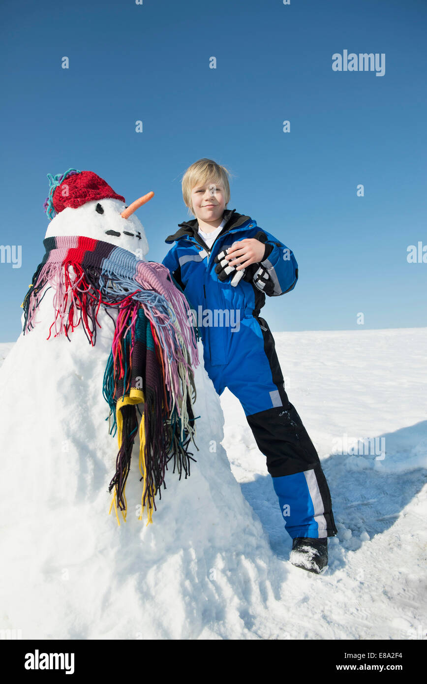 Boy standing with snowman, Bavaria, Germany Stock Photo - Alamy