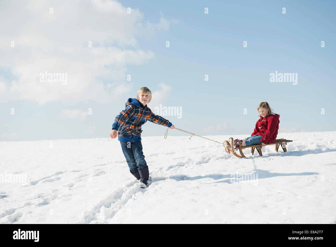 Boy pulling sledge hi-res stock photography and images - Alamy