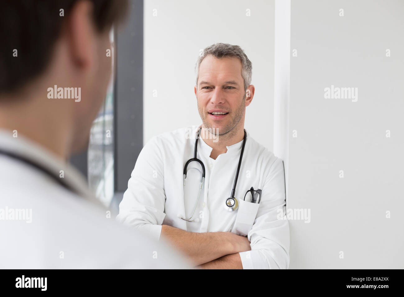 Doctors having conversation Stock Photo - Alamy
