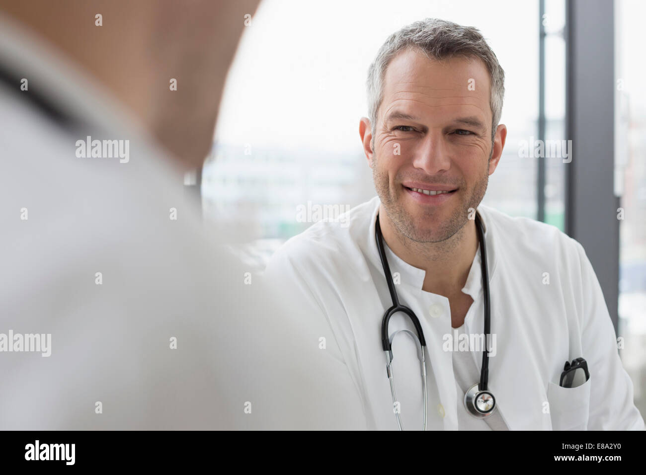 Doctors having conversation Stock Photo - Alamy