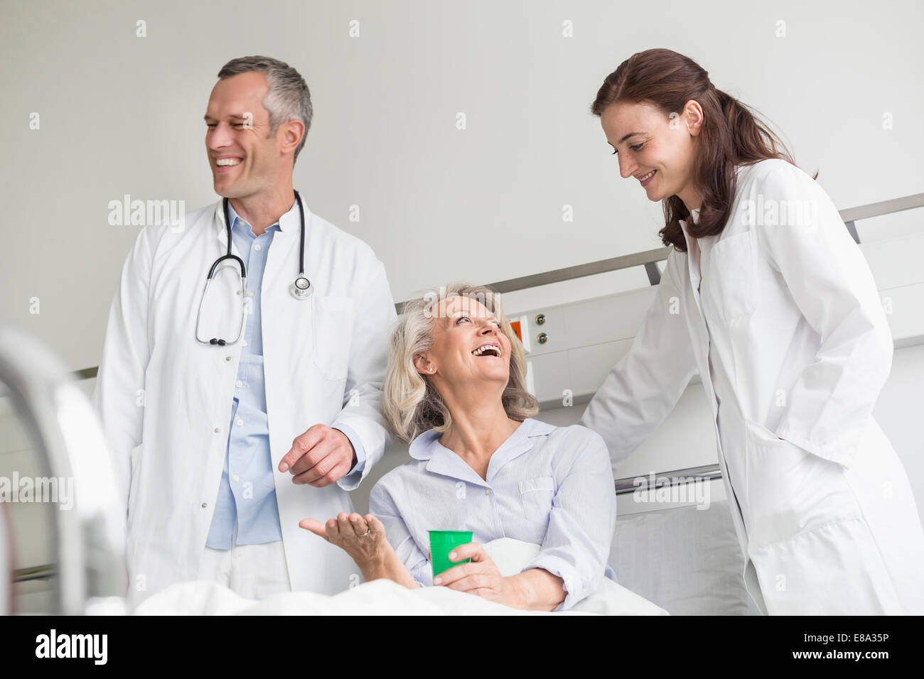 Doctors' visit in hospital Stock Photo - Alamy