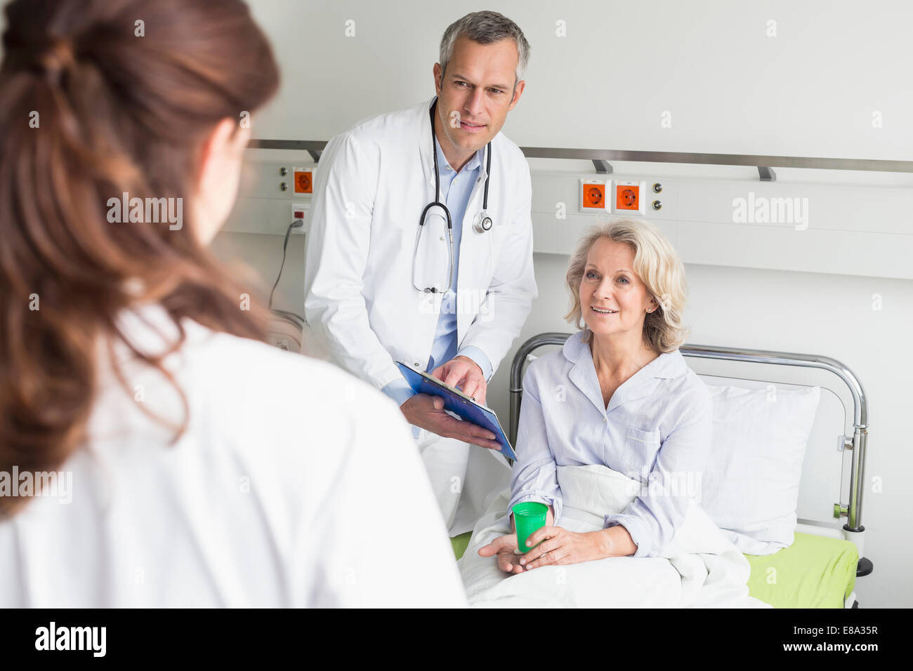 Doctors' visit in hospital Stock Photo - Alamy