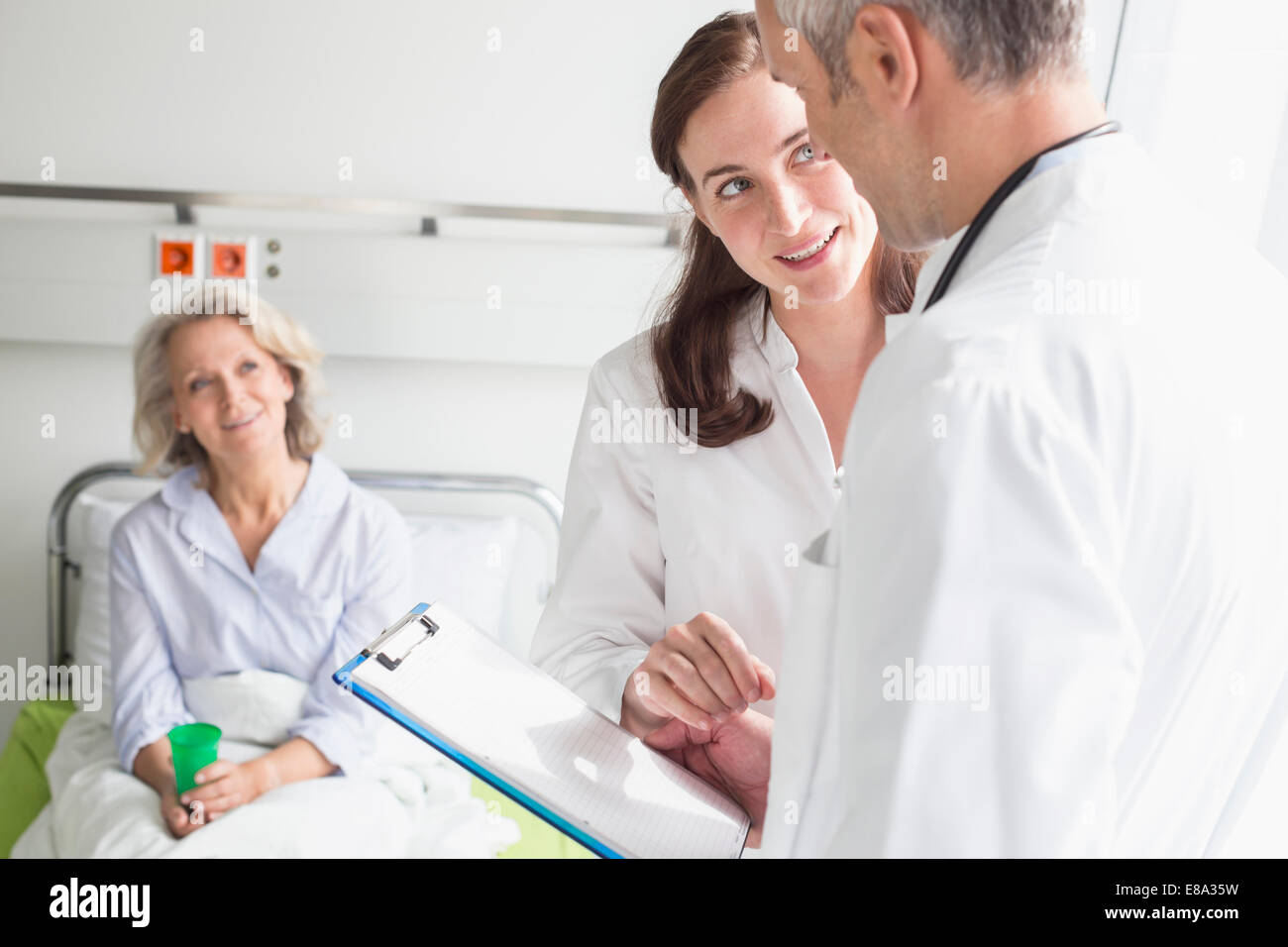 Doctors' visit in hospital Stock Photo - Alamy