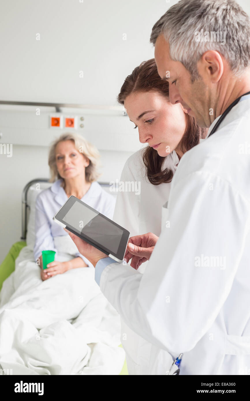Doctors' visit in hospital Stock Photo - Alamy