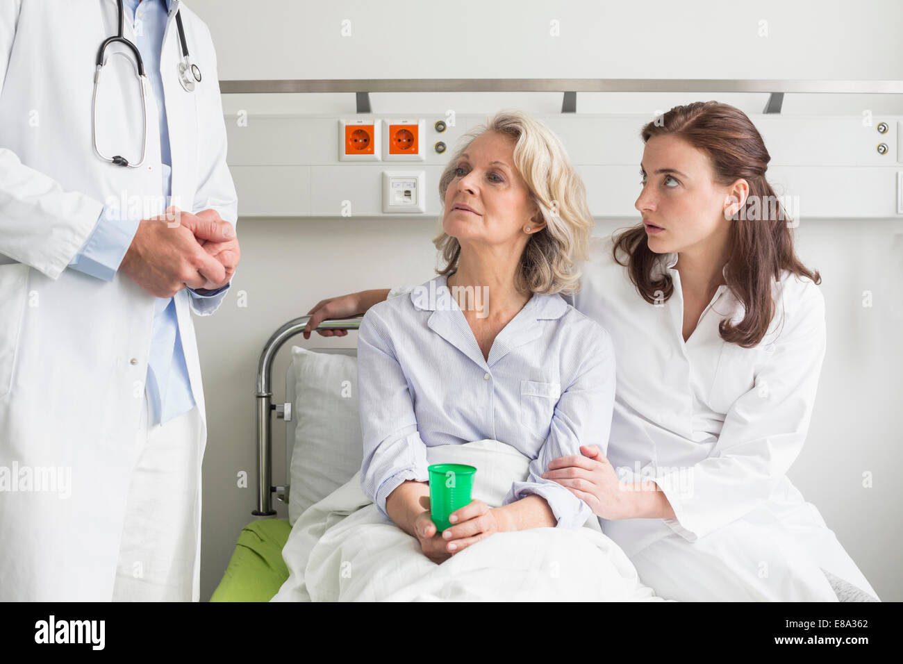 Doctors' visit in hospital Stock Photo - Alamy