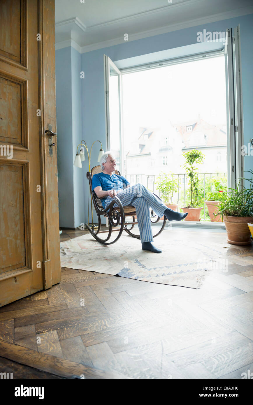 Man sitting on rocking chair hi-res stock photography and images - Alamy