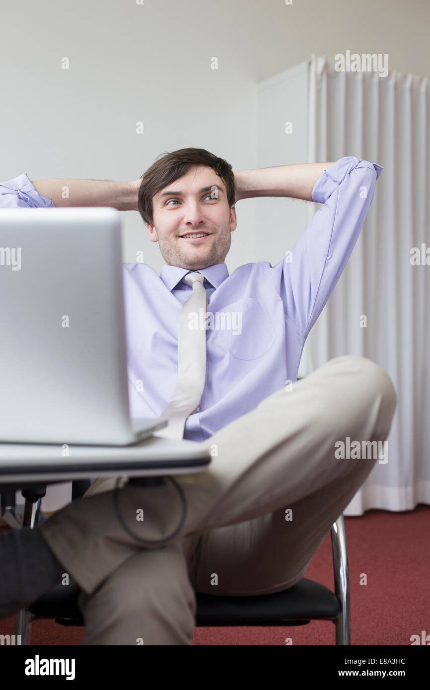 businessman sitting in office, smiling Stock Photo - Alamy