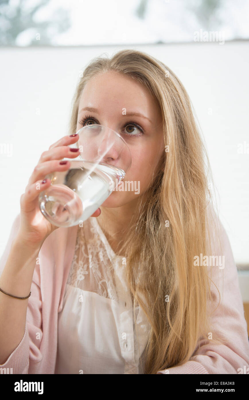 Teenage girl drinking water, close up Stock Photo - Alamy
