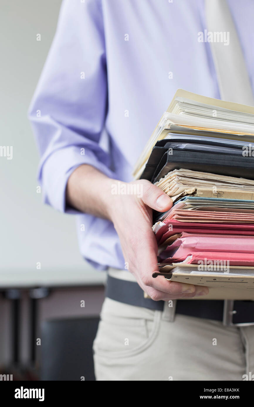 Male carrying files office hi-res stock photography and images - Alamy