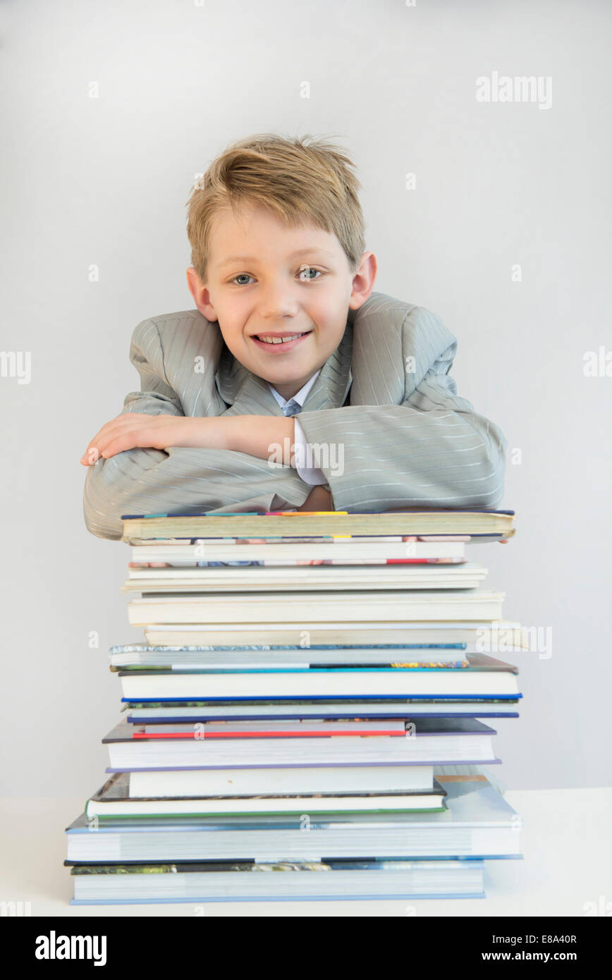 Boy smiling head on arms hi-res stock photography and images - Alamy