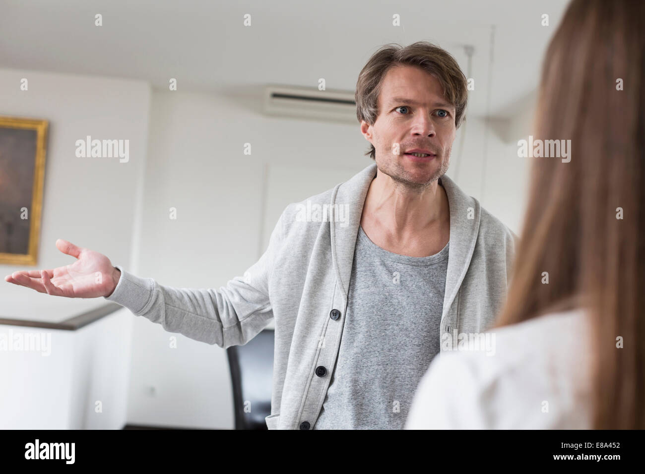 Couple having discussion Stock Photo - Alamy