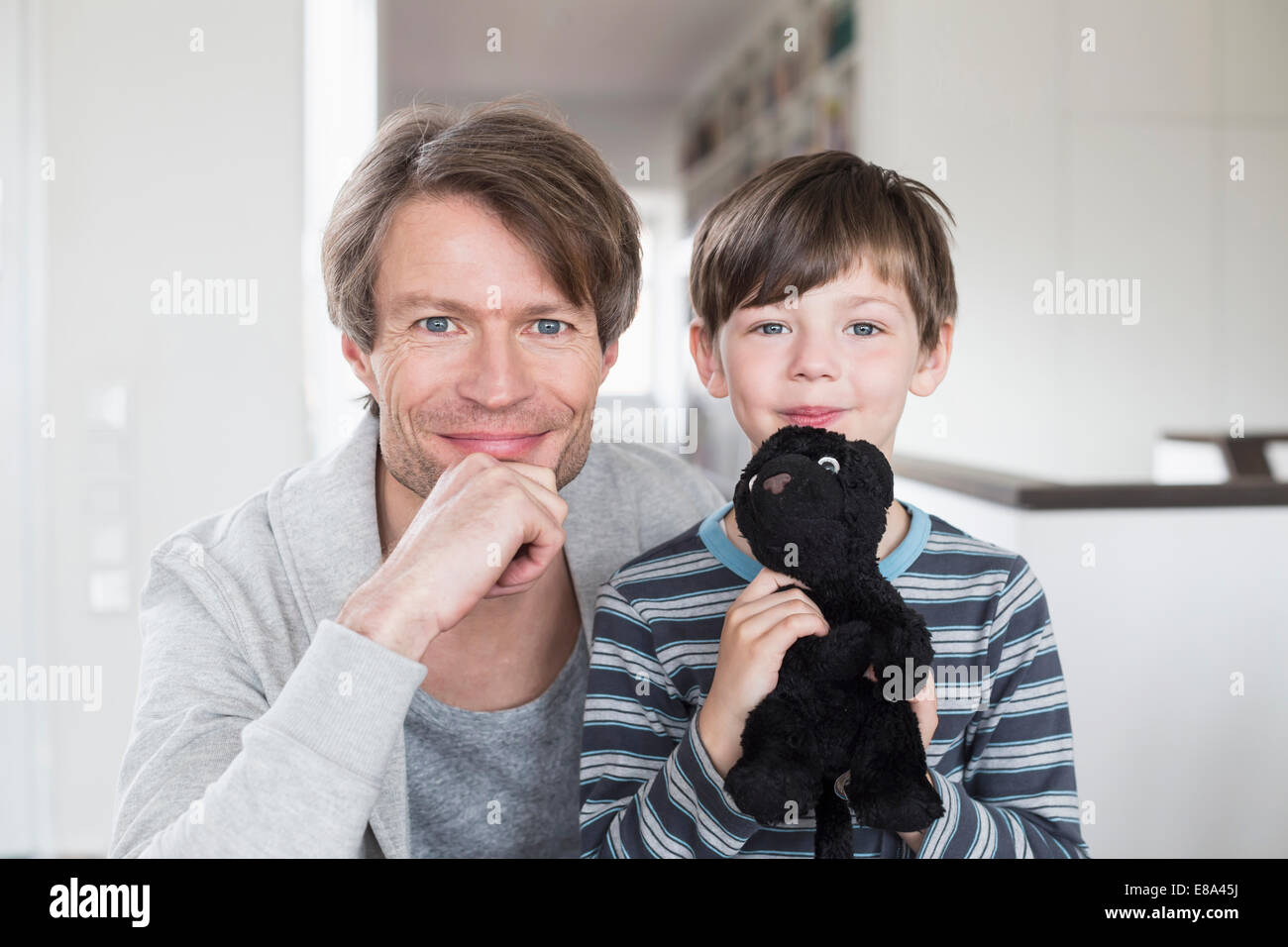 Portrait of father and son, smiling Stock Photo - Alamy