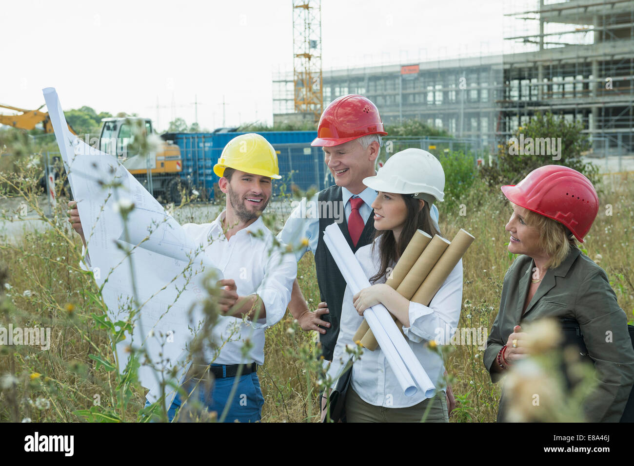 Architect and building owners on site inspection Stock Photo - Alamy