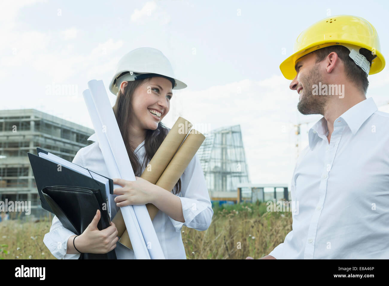 Architect and assistant, smiling Stock Photo - Alamy