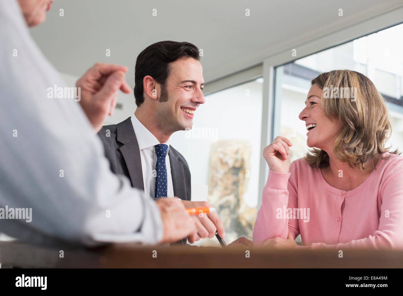 Consultant advising couple at home Stock Photo - Alamy