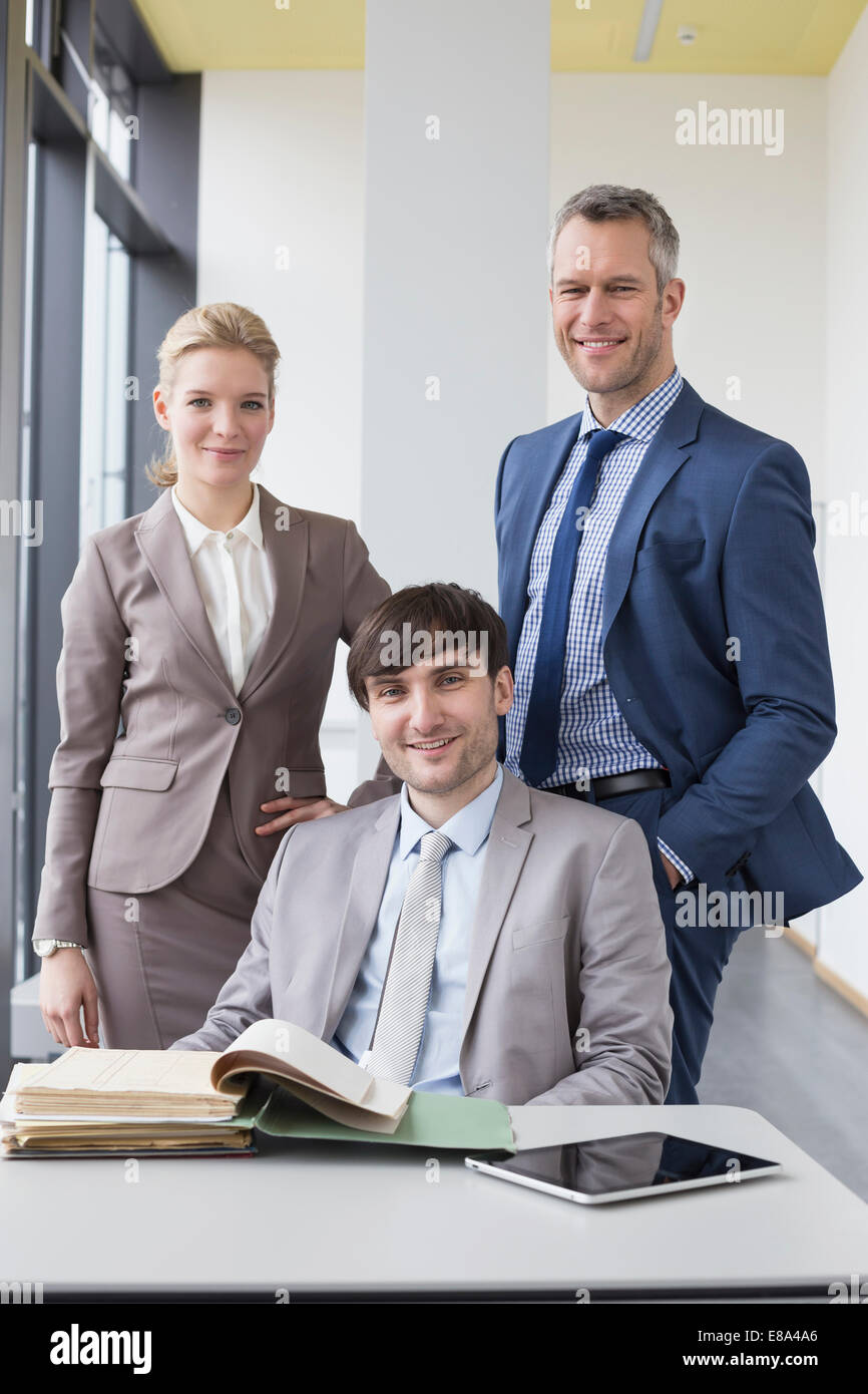 Portrait of colleagues in office, smiling Stock Photo - Alamy
