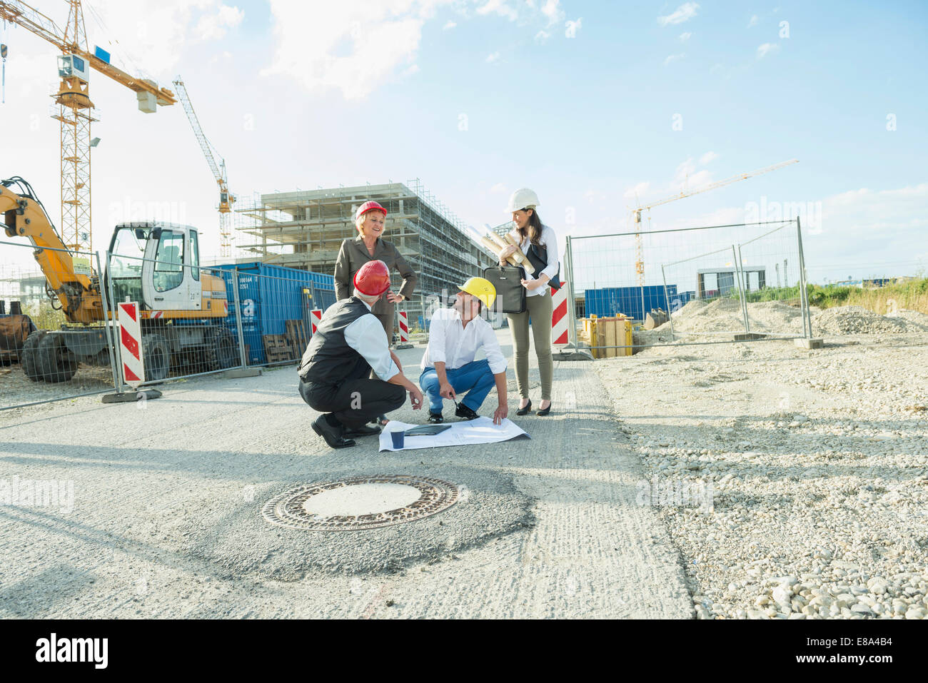 Architect discussing with customers Stock Photo - Alamy