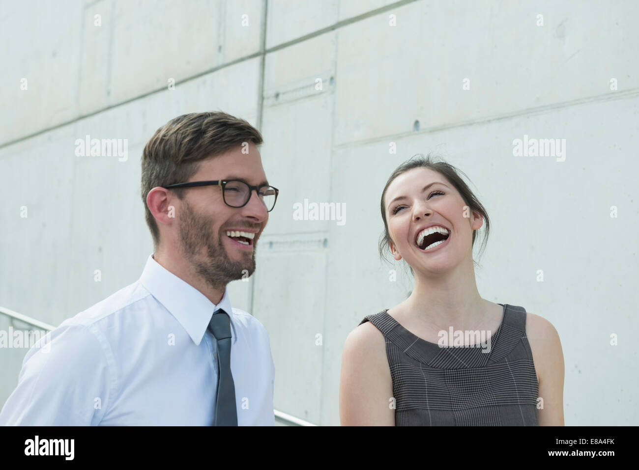 two business partners laughing Stock Photo - Alamy