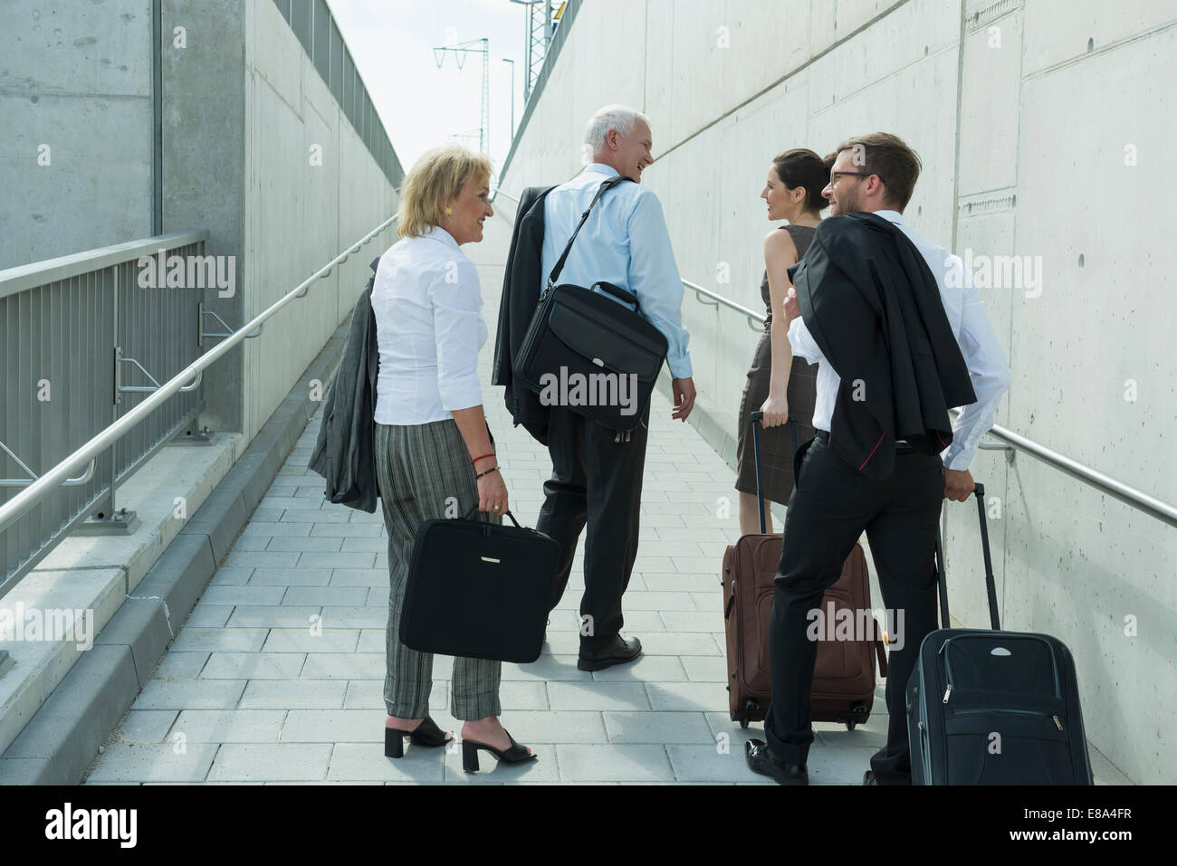 four colleagues on business travel Stock Photo - Alamy